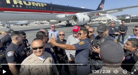 Uniformed Los Angeles Airport Police and Firefighters Take Selfies With ...